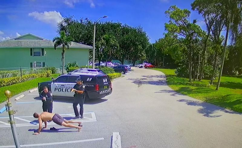 Victory for Gardens officer who held unarmed man at gunpoint in viral ...