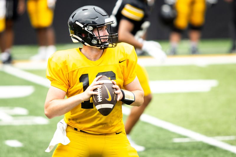 Pat Fitzgerald to coach Michigan State. What is his record vs. Iowa?