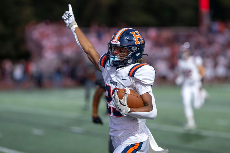 Harrison football's defense hammers down to claim rivalry win over ...