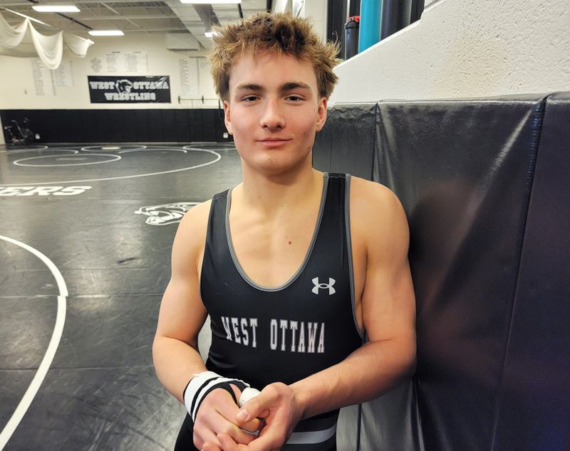 Thumbs up for James Foster, who aims for wrestling podium despite injury