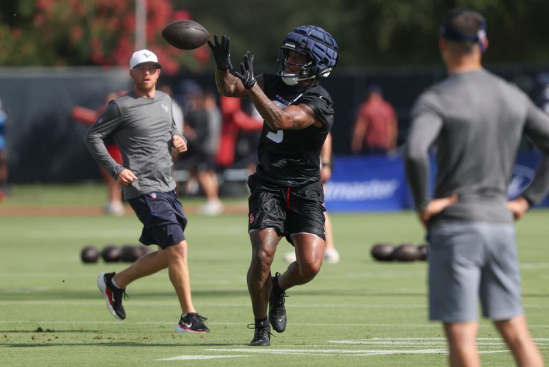 WATCH: Texans TE Brevin Jordan gets fans ready to run through a brick ...